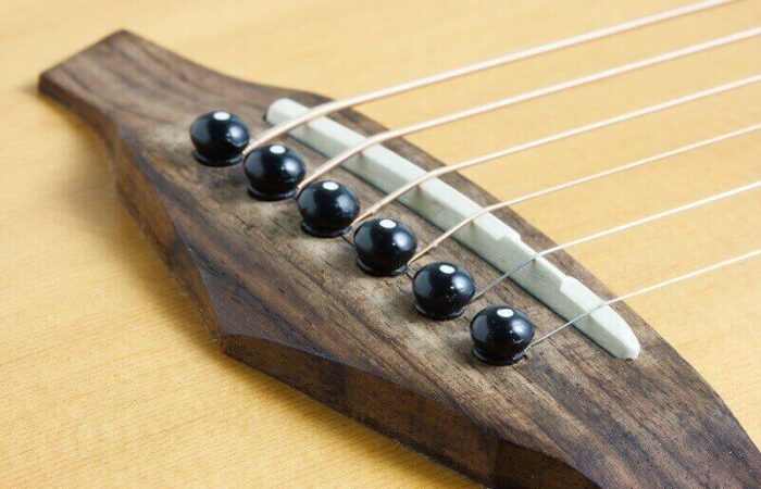 Best Bridge Pins For Acoustic Guitars: Materials & Guide